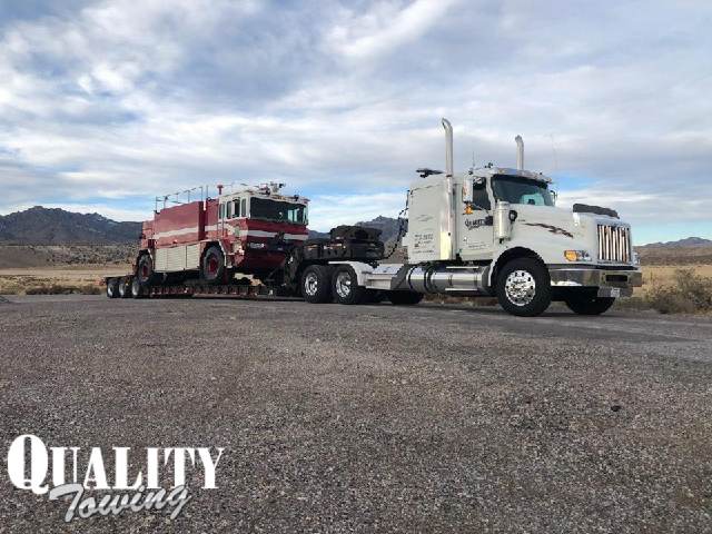 Lowboy Towing A Fire Truck to Las Vegas - Quality Towing